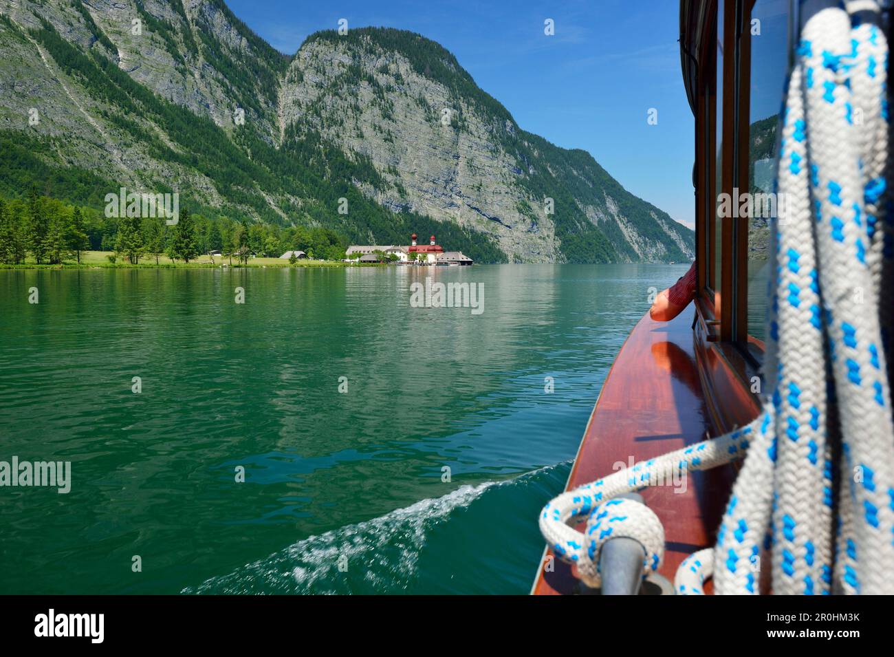 Boat crossing lake Koenigssee towards St. Bartholomae, St. Bartholomae ...