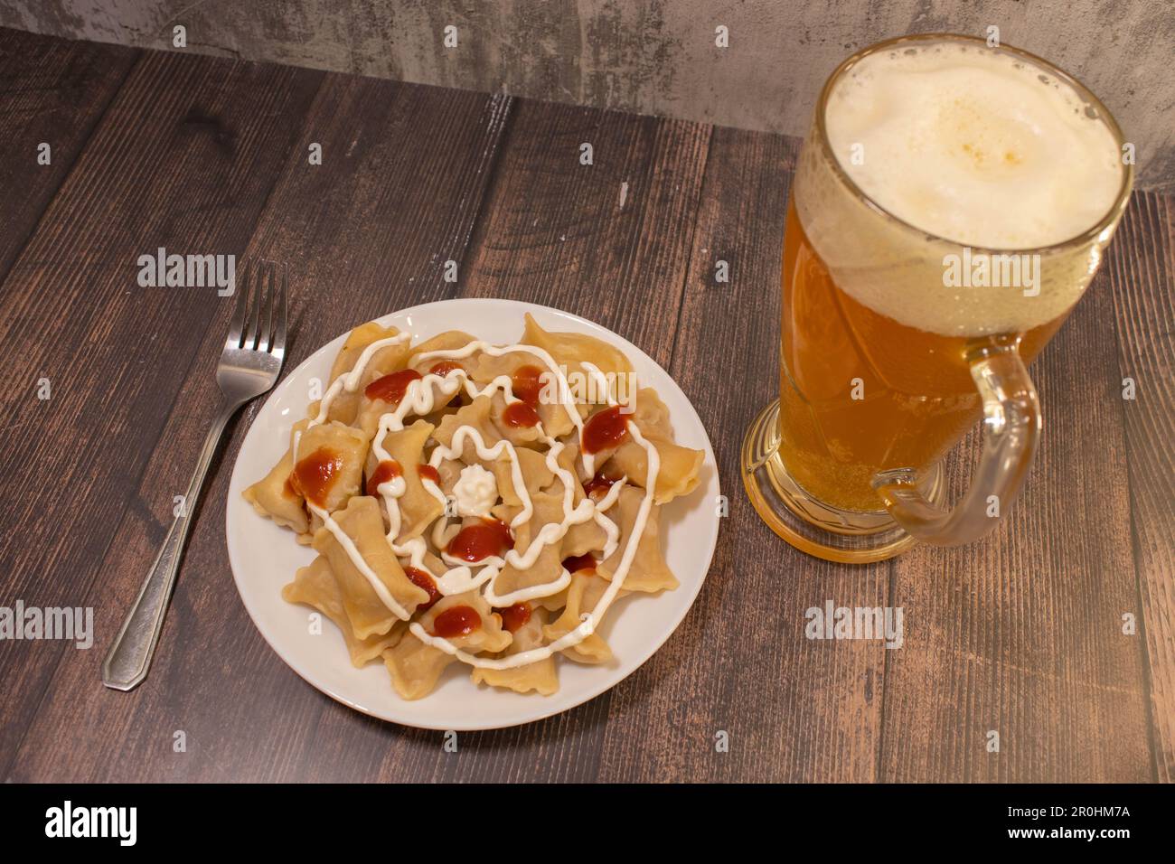 austrian cheese dumpling soup on wood with beer Stock Photo - Alamy