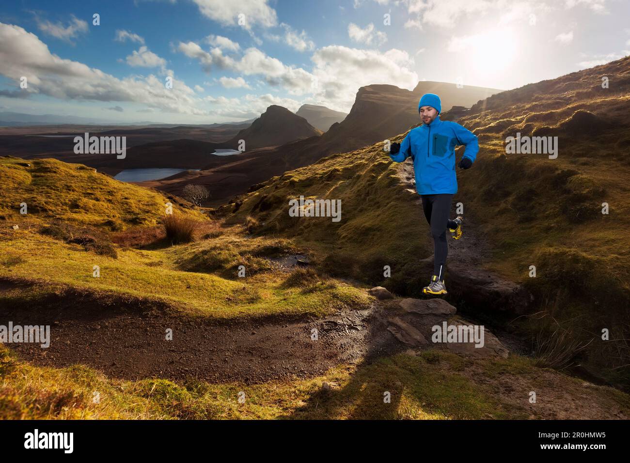 Young man running on a trail, Quiraing, Trotternish peninsula, Isle of ...