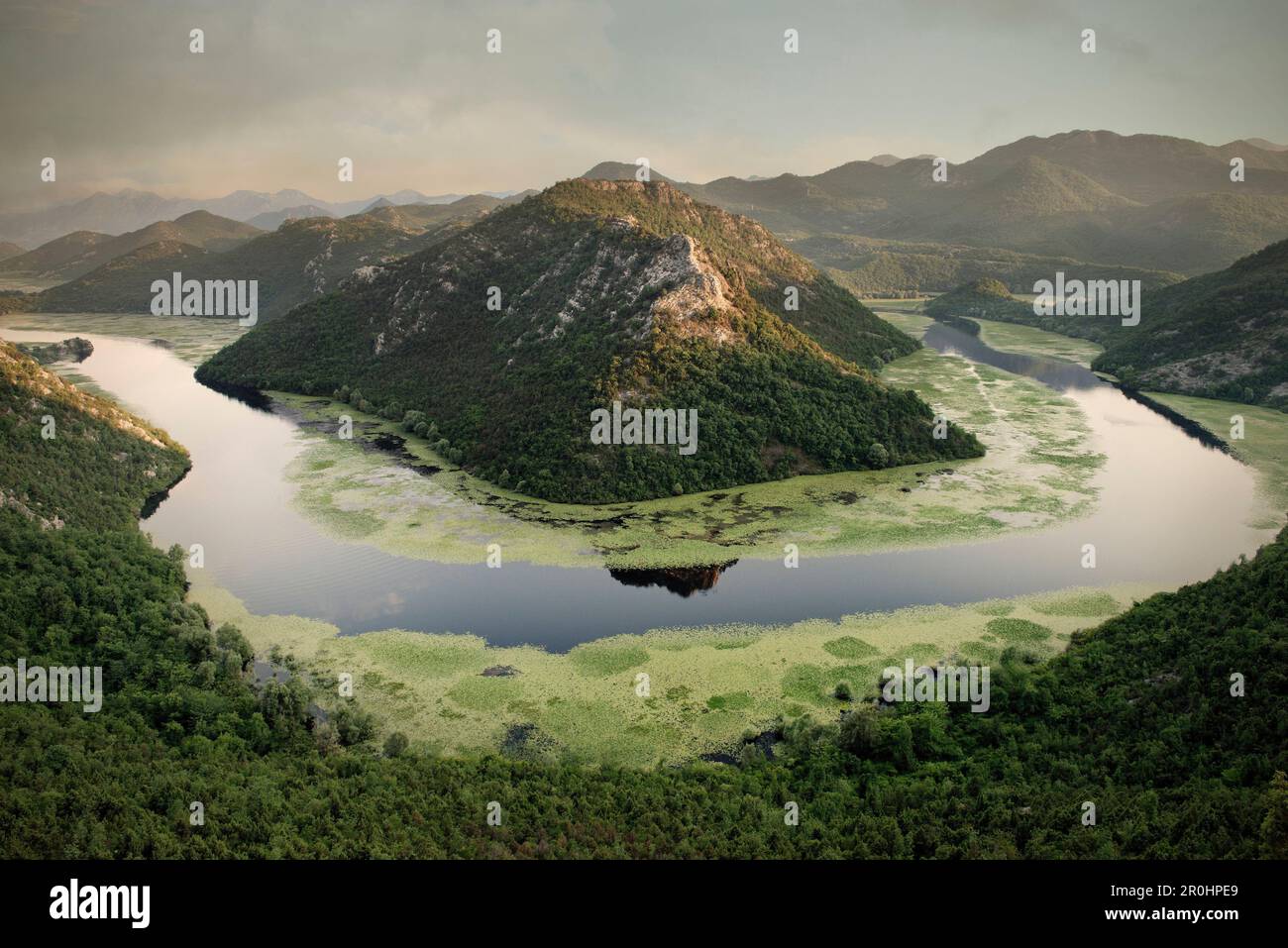Dramatic sky with view of the river bend of the Rijeka Crnojevica river, Lake Skadar National ...