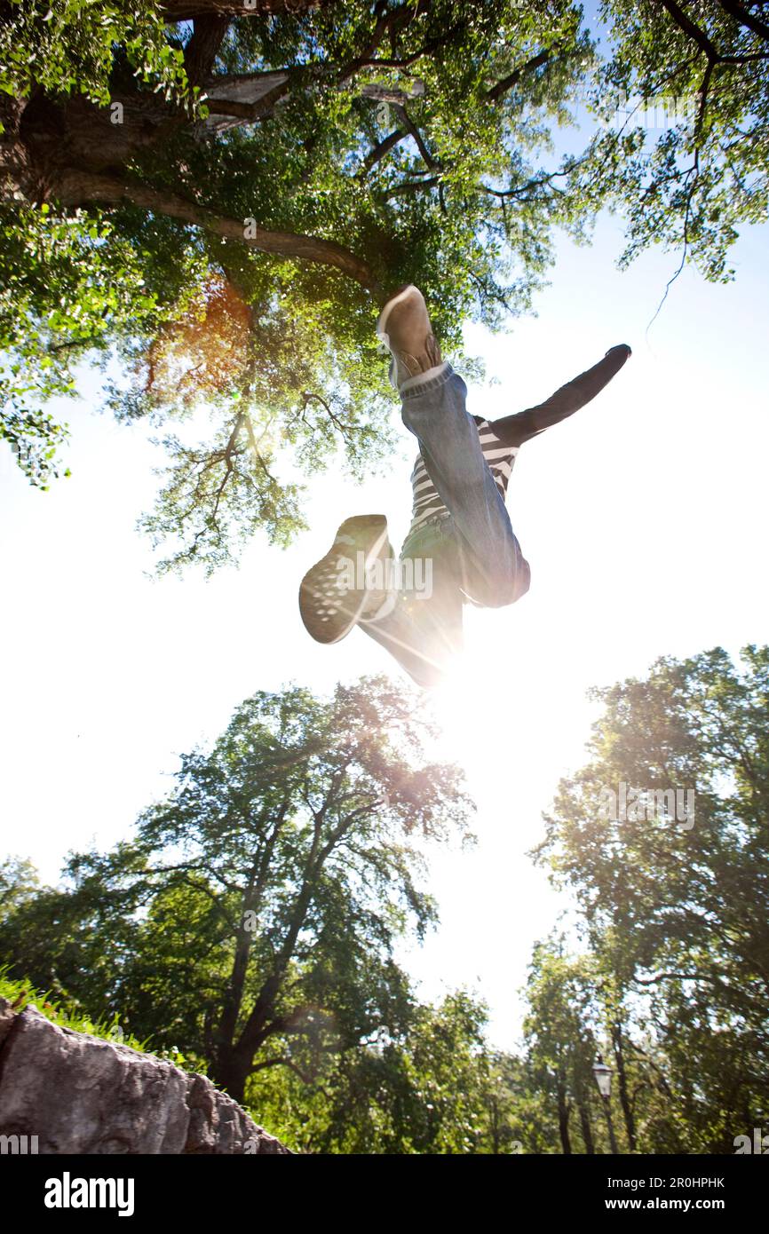 Back view man jumping hi-res stock photography and images - Alamy