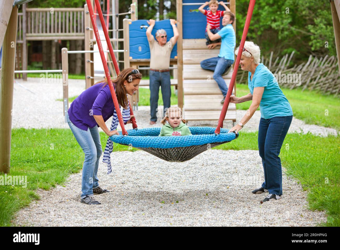 Multi generational family on playground, Styria, Austria Stock Photo ...