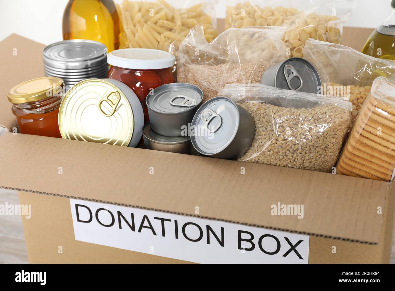 Donation box full of different food , closeup Stock Photo - Alamy