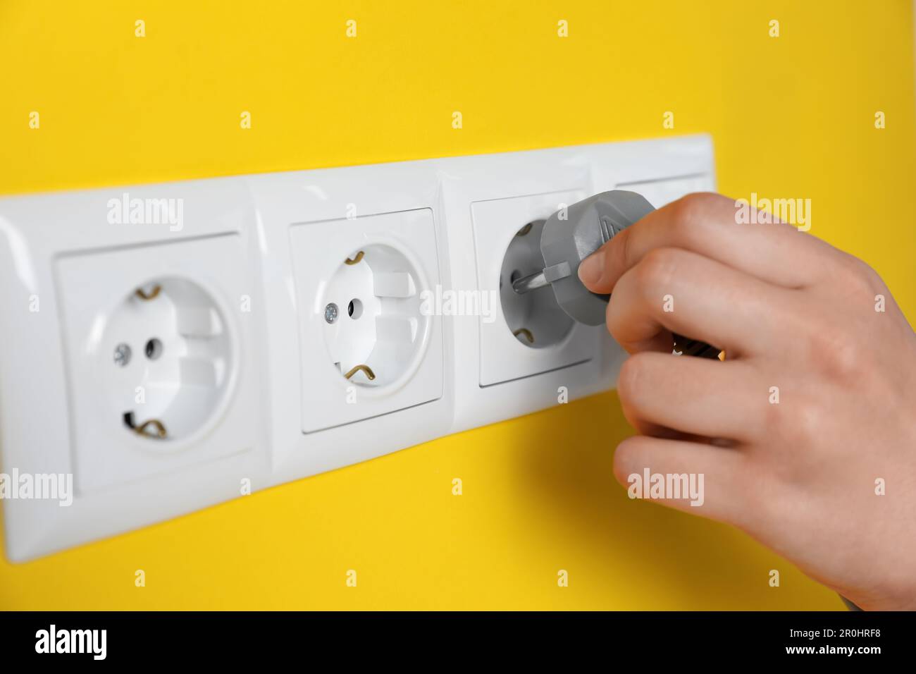 Hand inserting electrical plug hi-res stock photography and images - Alamy
