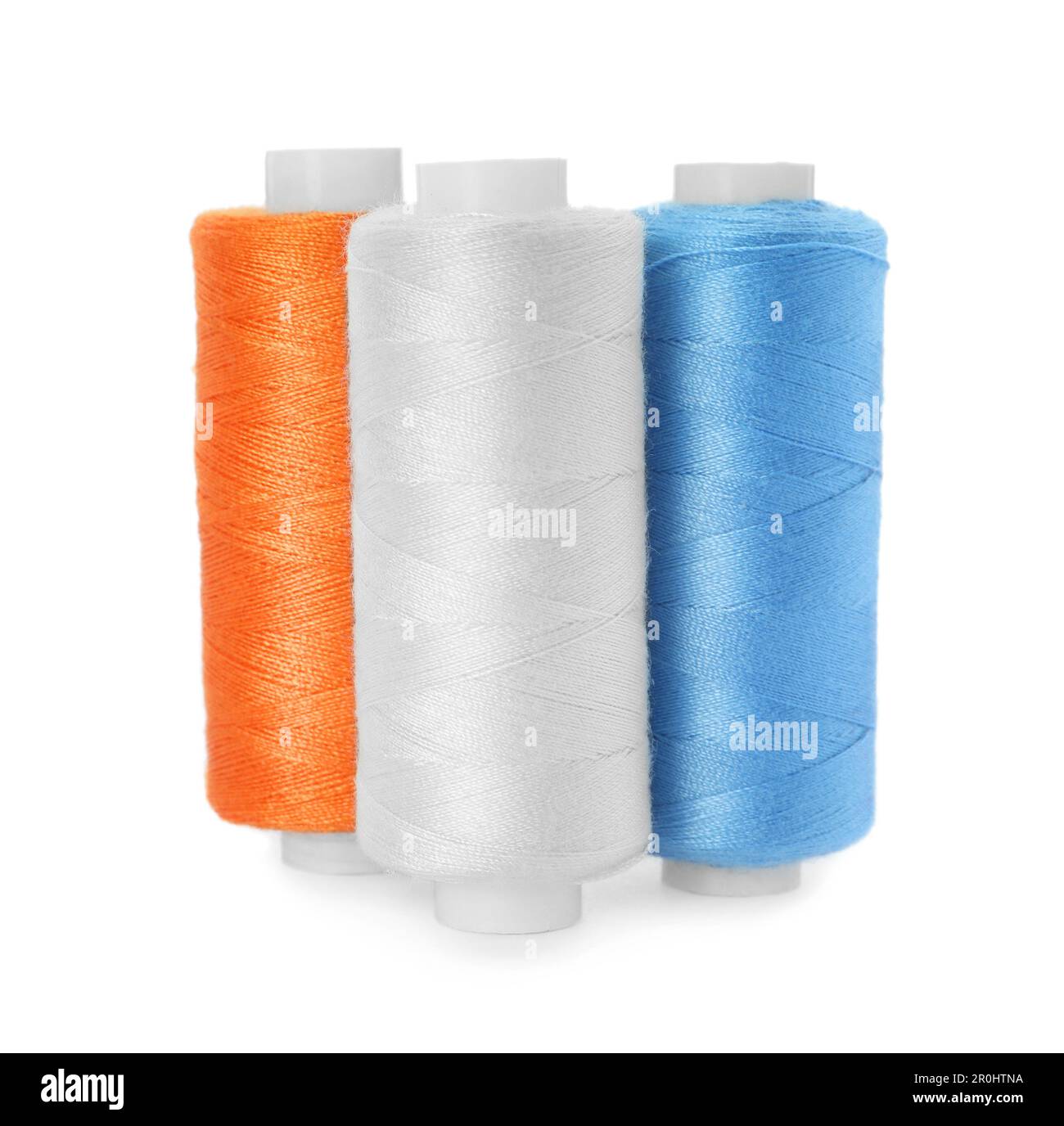 Different colorful sewing threads on white background Stock Photo - Alamy