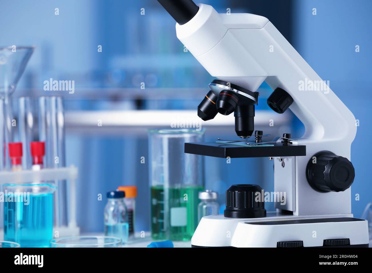 Modern medical microscope on table in laboratory. Space for text Stock ...