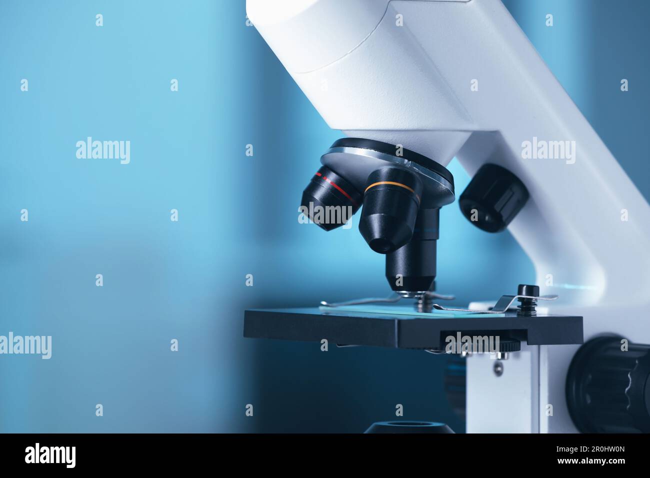 Modern medical microscope against blurred background, closeup. Space ...