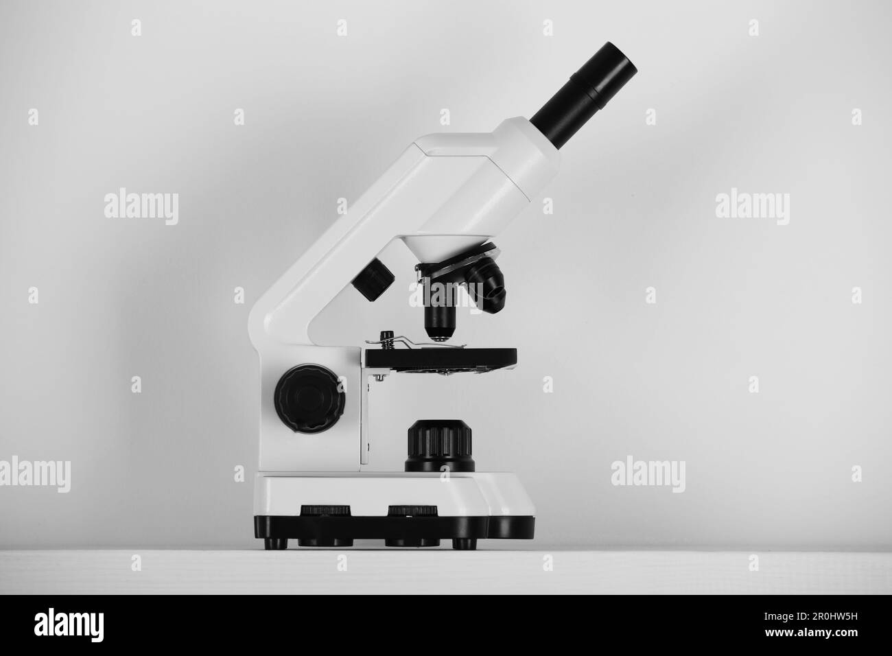 Modern microscope on light background. Medical equipment Stock Photo ...