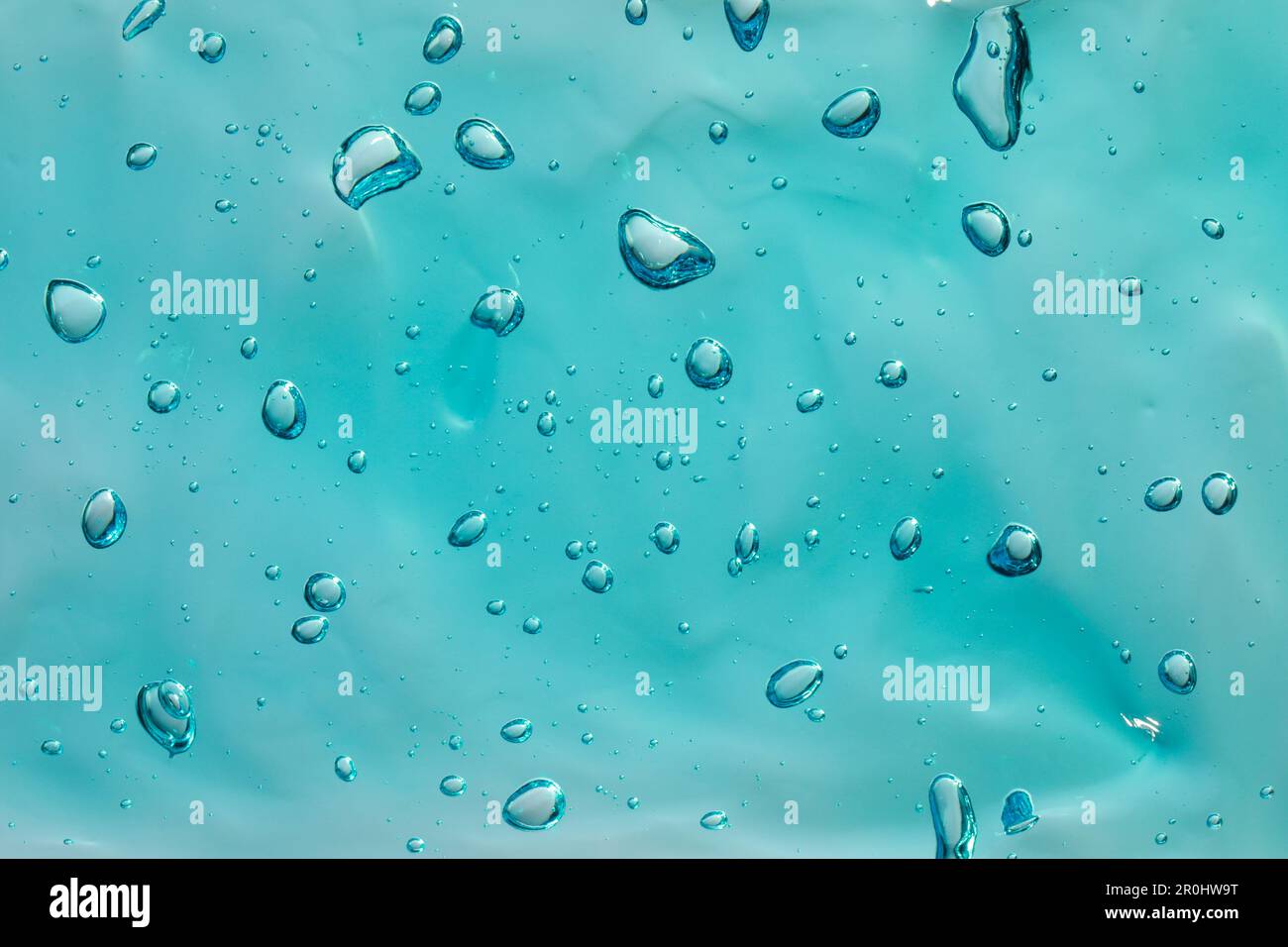 Turquoise facial gel as background, closeup view Stock Photo - Alamy