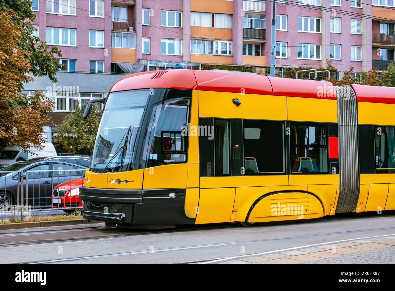 Modern tram on city street. Public transport Stock Photo - Alamy