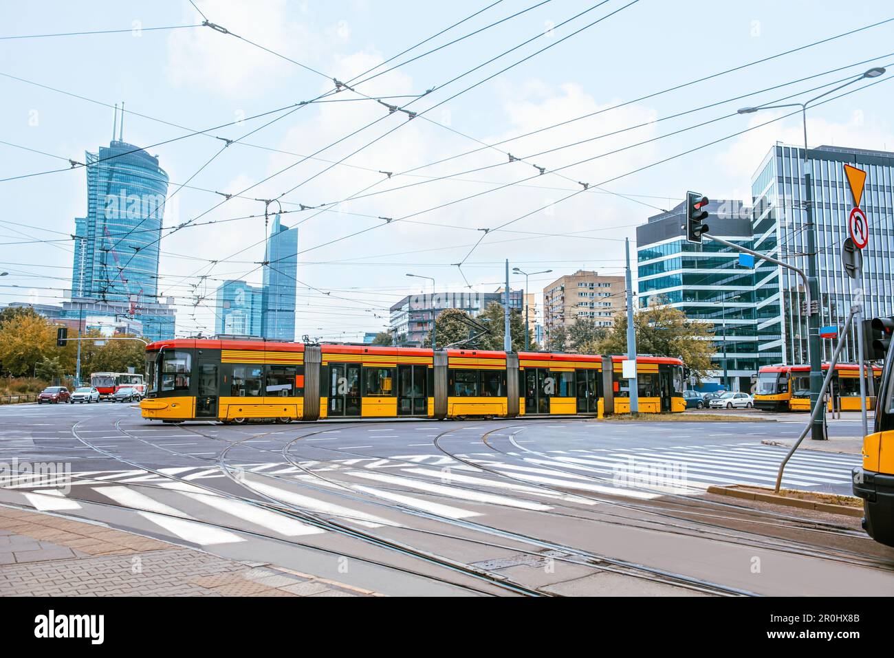 Modern trams on city street. Public transport Stock Photo - Alamy