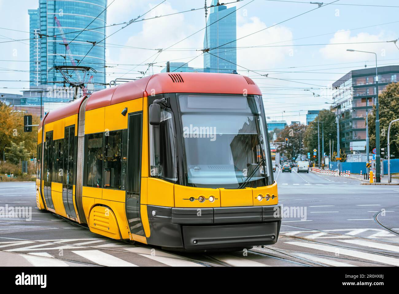 Modern tram on city street. Public transport Stock Photo - Alamy