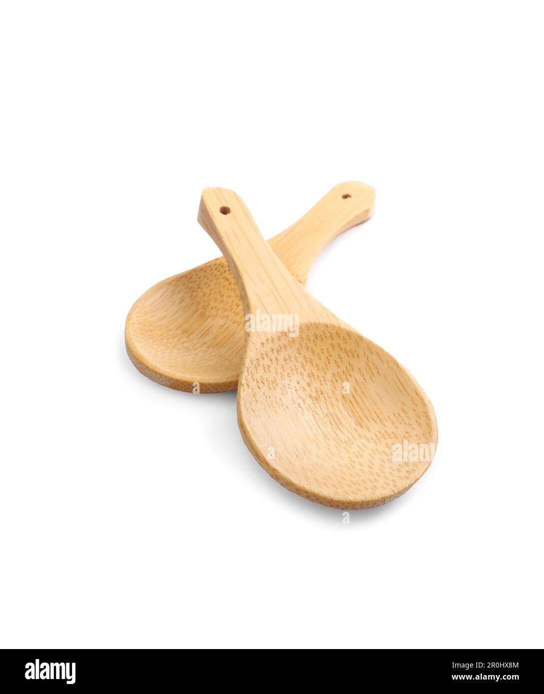 Two new wooden spoons on white background Stock Photo - Alamy