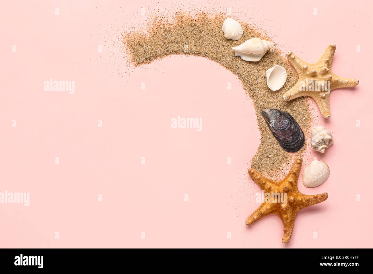 Stroke of sand with seashells and starfishes on pink background Stock ...