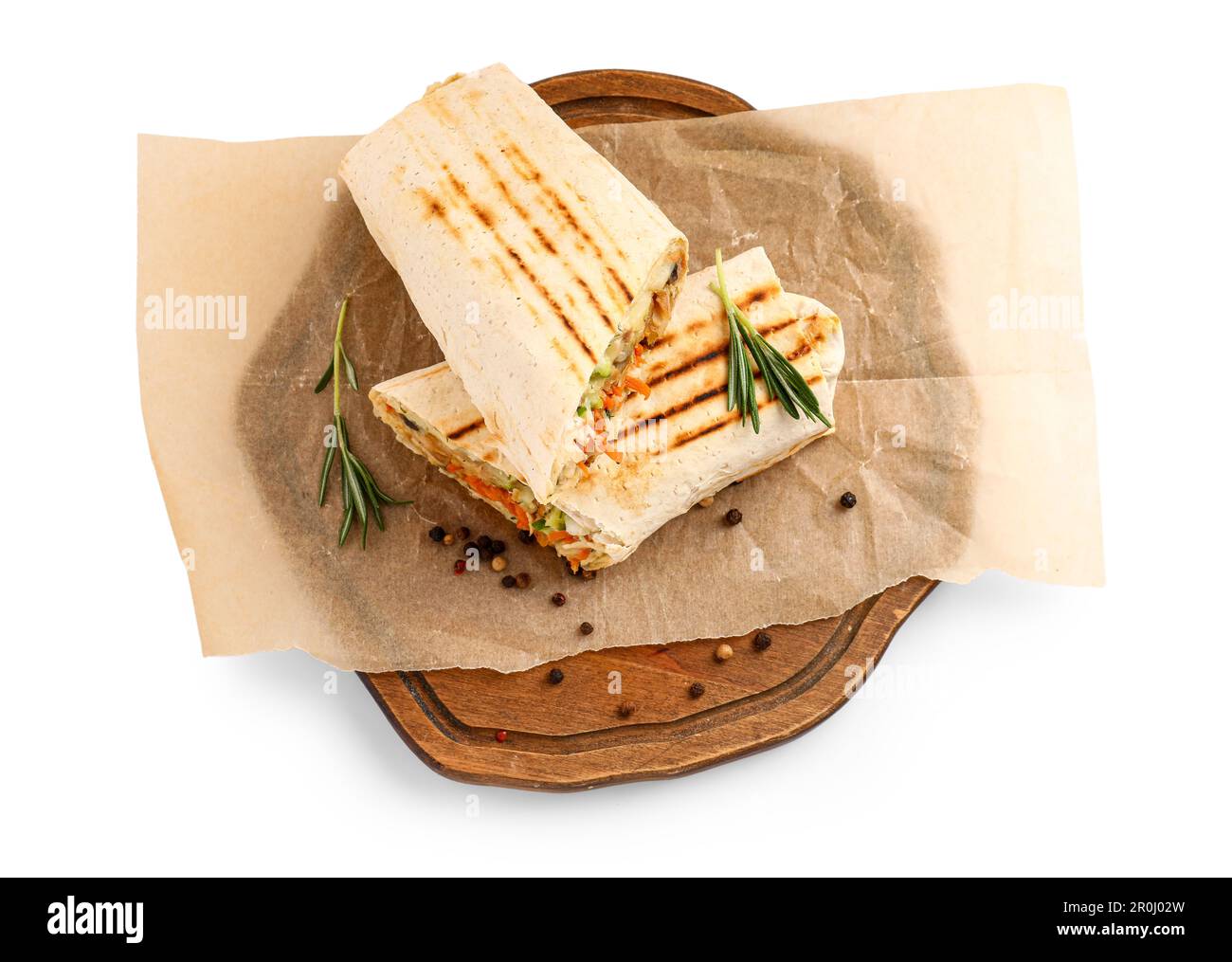 Board of baking paper with tasty shawarma on white background Stock ...