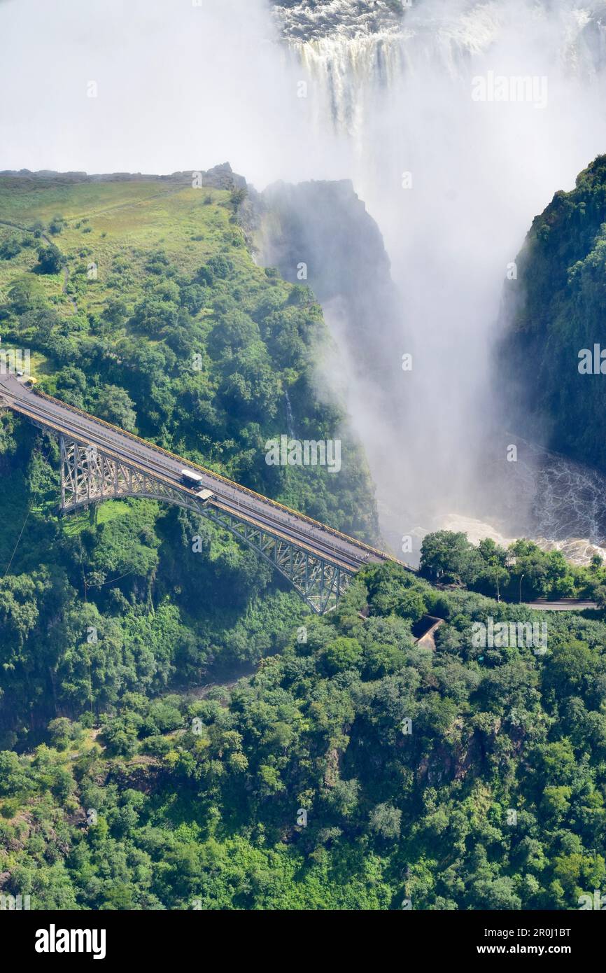 Aerial view of Victoria Falls Bridge with Bam Bam train and the falls ...