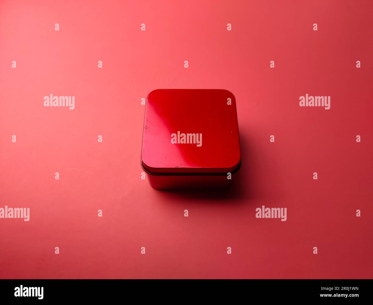 Closeup red aluminium box on a red background Stock Photo - Alamy