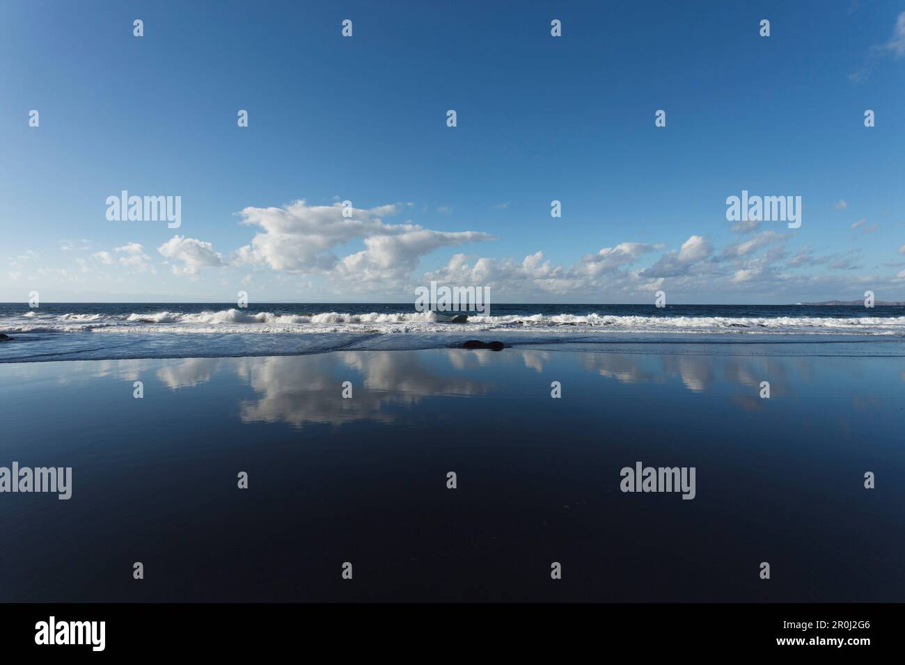 Cloud reflection on Playa del Risco, beach near Agaete, Atlantic ocean ...