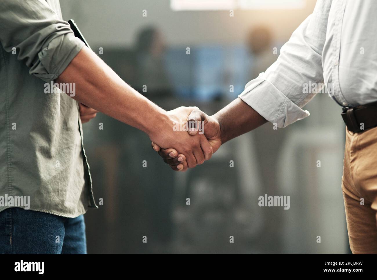 Time to take over. a two unrecognizable businessmen standing in the ...