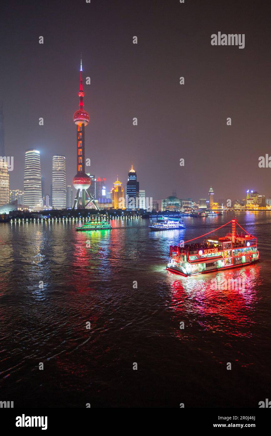 Sightseeing boats on the Huangpu River with Oriental Pearl Tower and ...
