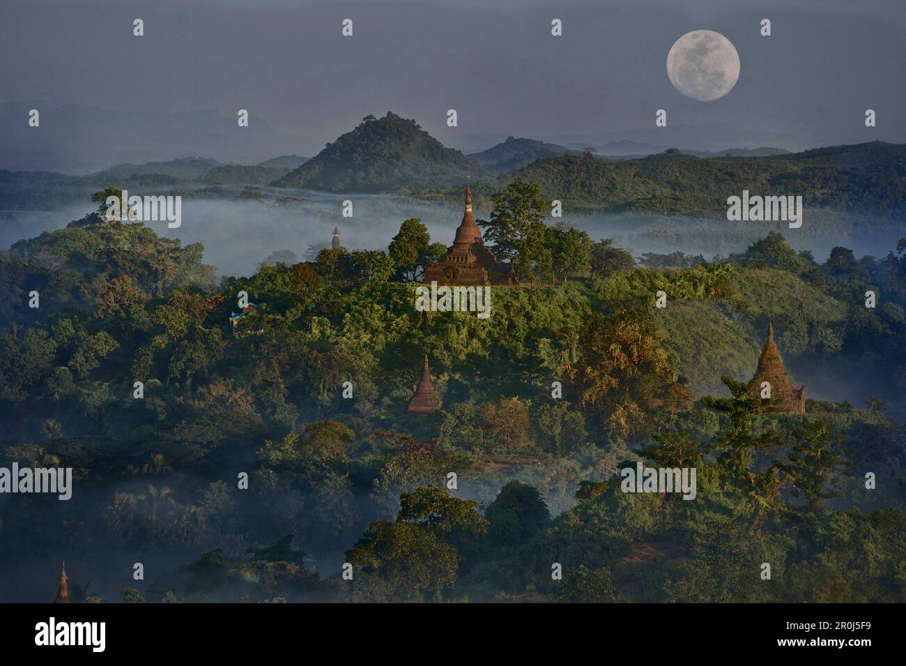 View above hill and pagodas in the morning mist at Mrauk U, Myohaung ...