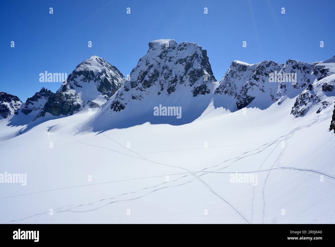 Tracks in snow, Great Piz Buin and Piz Buin Pitschen in background ...