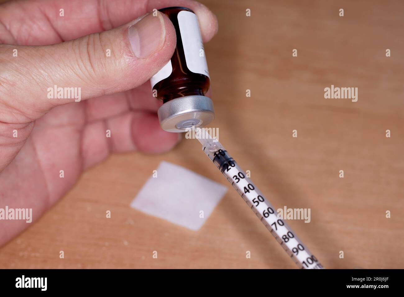 Close up of handheld needle and syringe with Testosterone Vial Stock ...