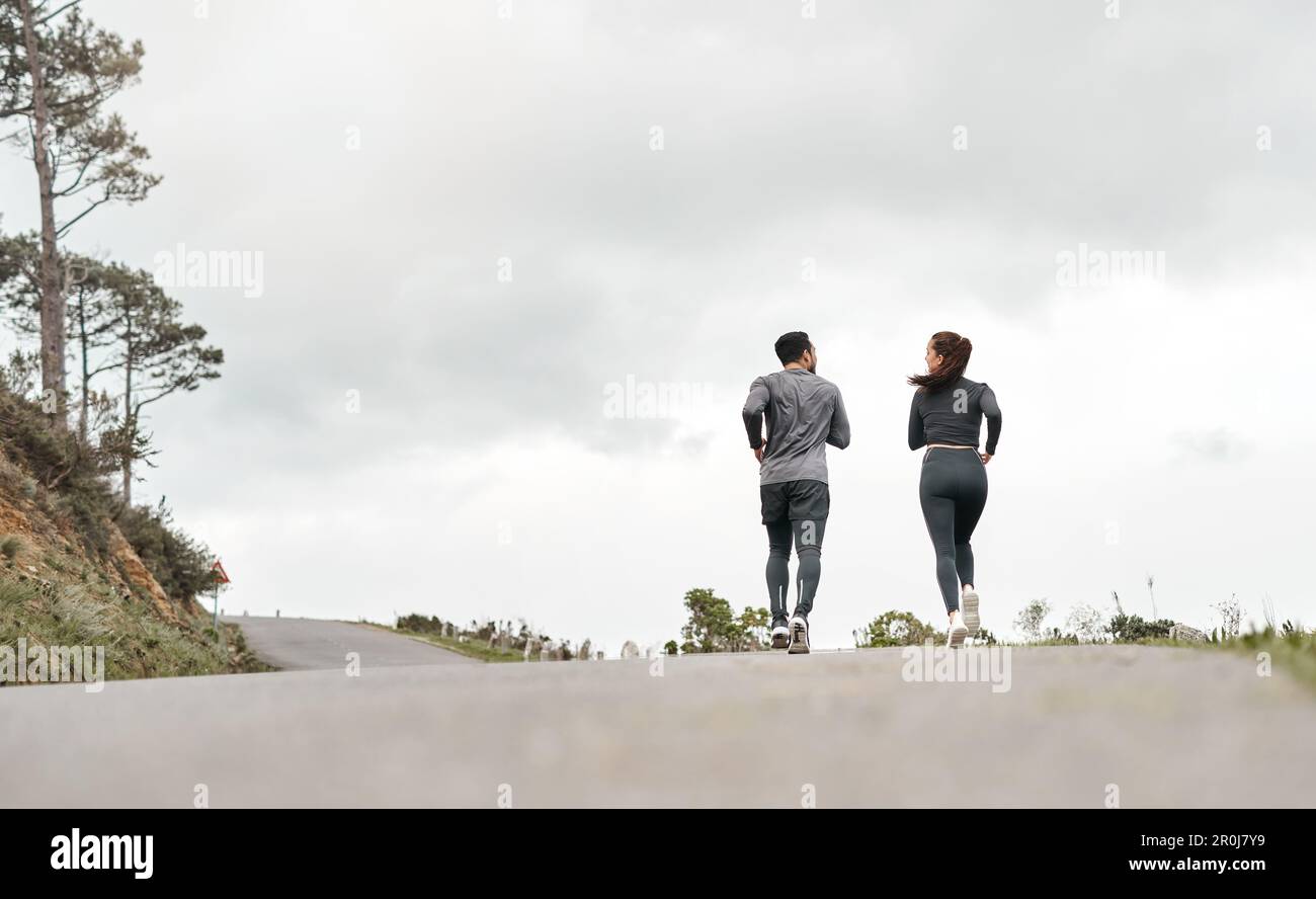 We keep each other on track with our fitness. Full length shot of two ...