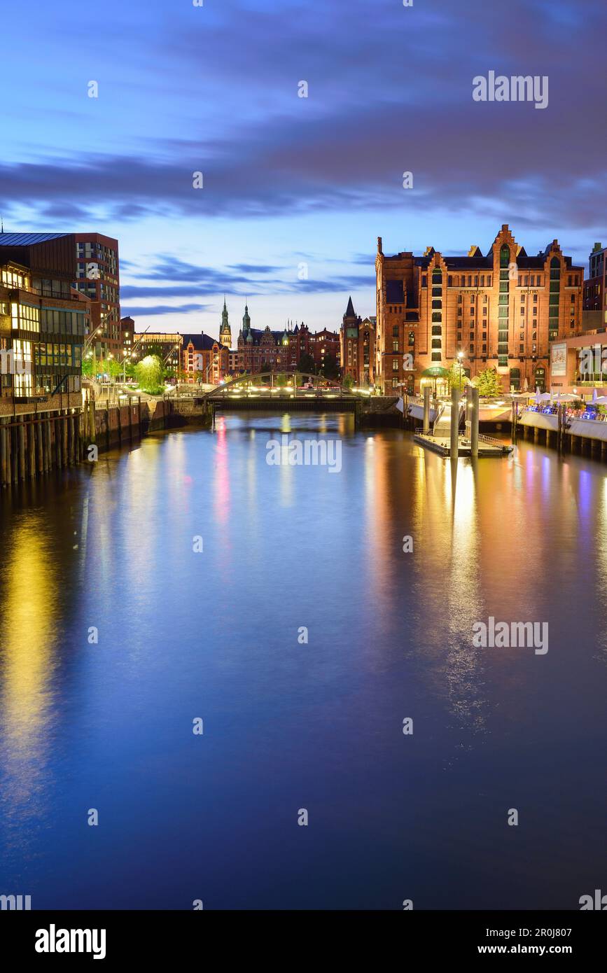 Illuminated port Magdeburger Hafen with warehouse district in the ...