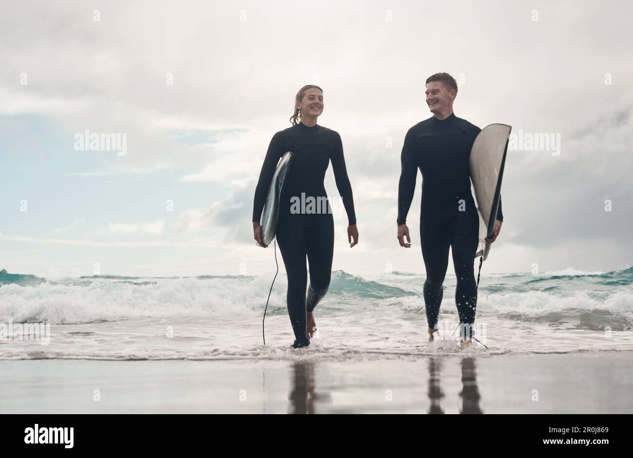 That was an amazing ride, right. a young couple out surfing together at ...