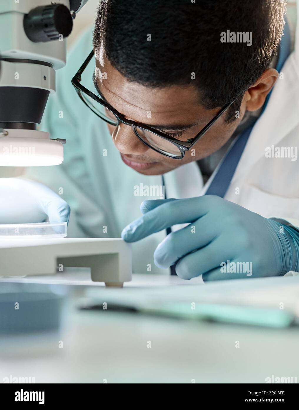 Science is such a fascinating field. a young scientist using a ...