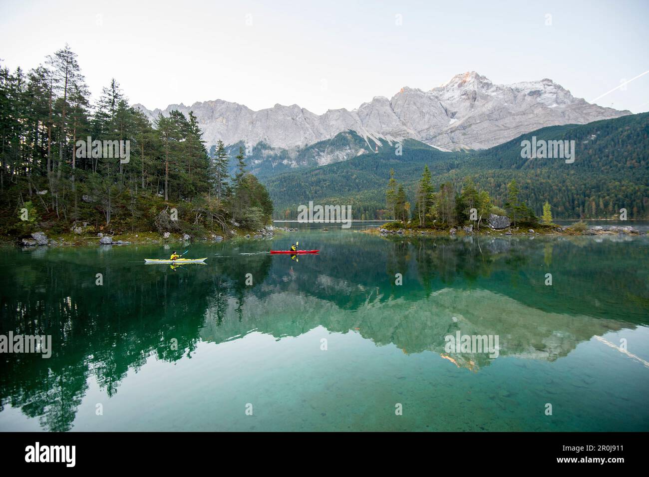 Kayaker paddling on lake Eibsee below Zugspitze, Grainau, Bavaria ...