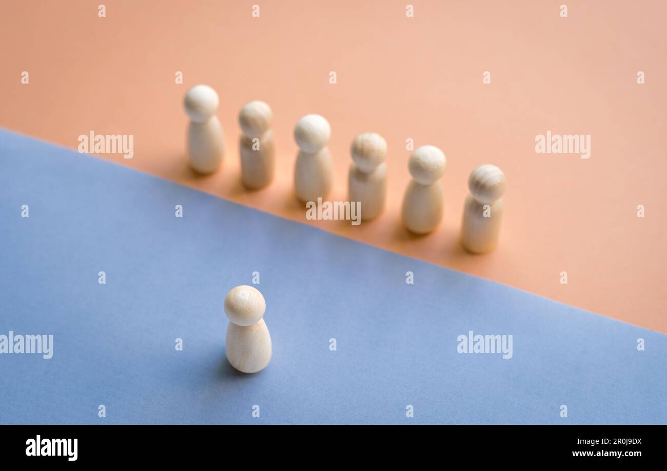 A wooden doll facing a row of dolls separated by different floor colors ...