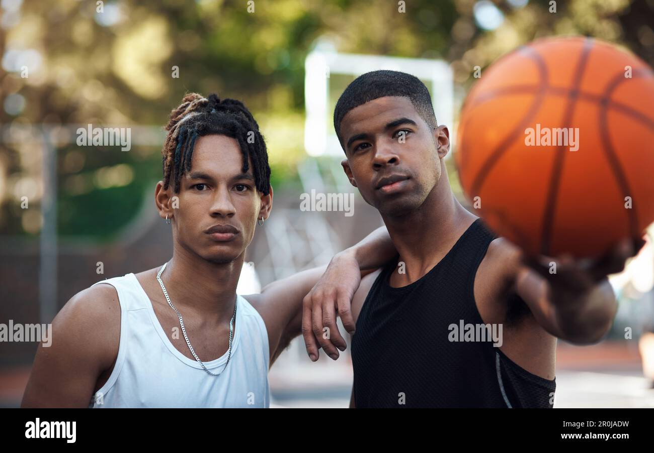 Becoming NBA stars of their own. Portrait of two sporty young men ...