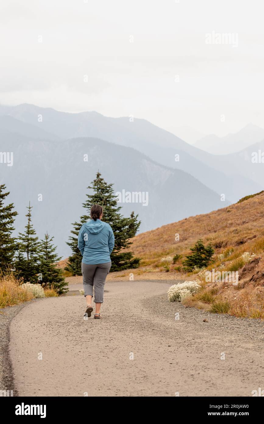 Young caucasian woman hikes at Hurricane Ridge in Olympic National Park ...