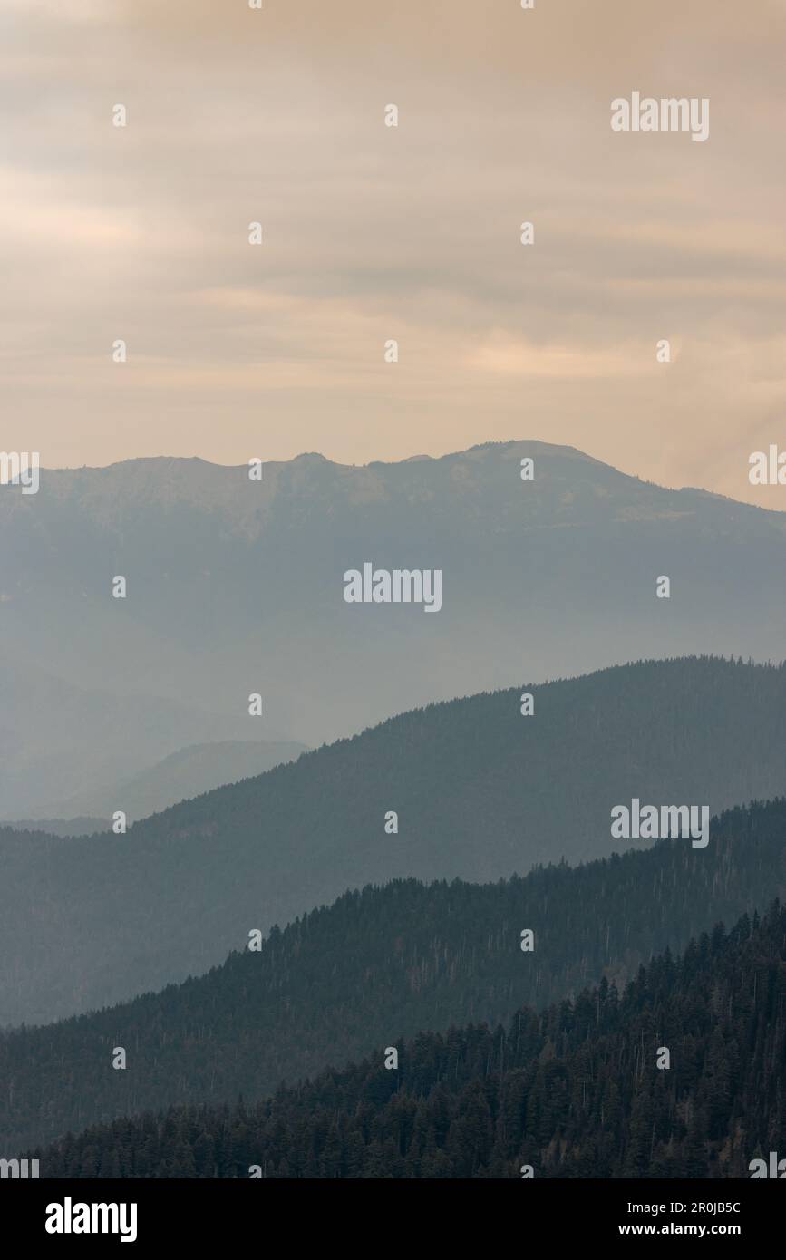Wavey ridge lines of varying mountain ranges are contrasted by the one ...