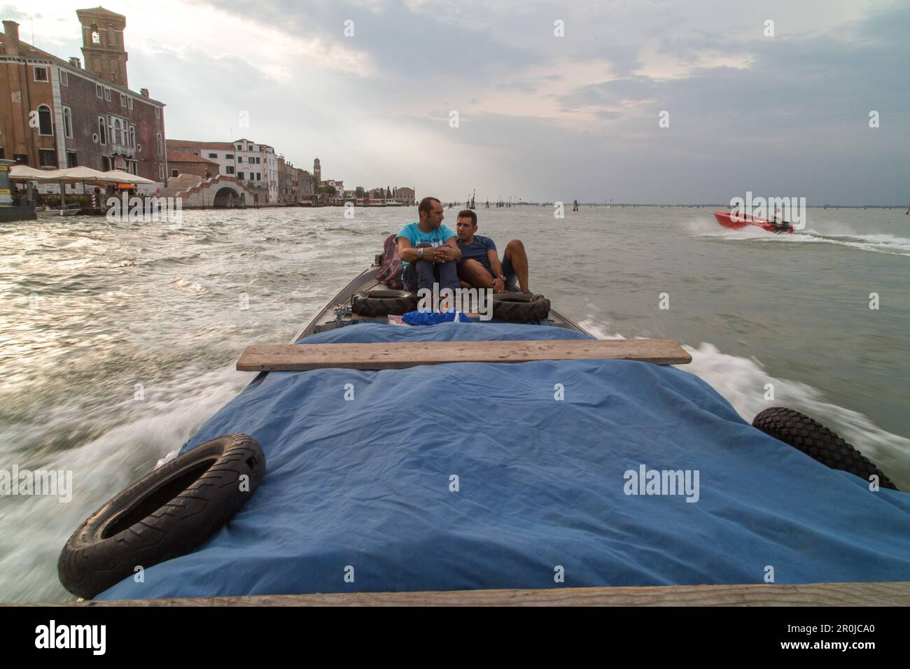vegetable orders from Sant'Erasmo Island, the plastic bags are loaded ...