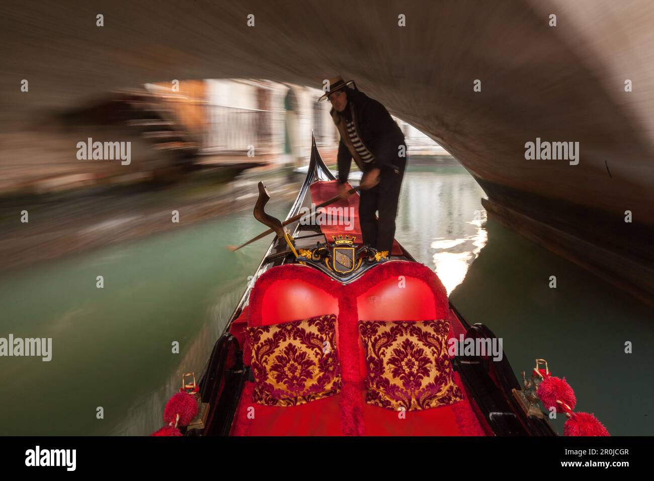 tourist trip on gondola in a narrow canal in historic Castello, art of ...