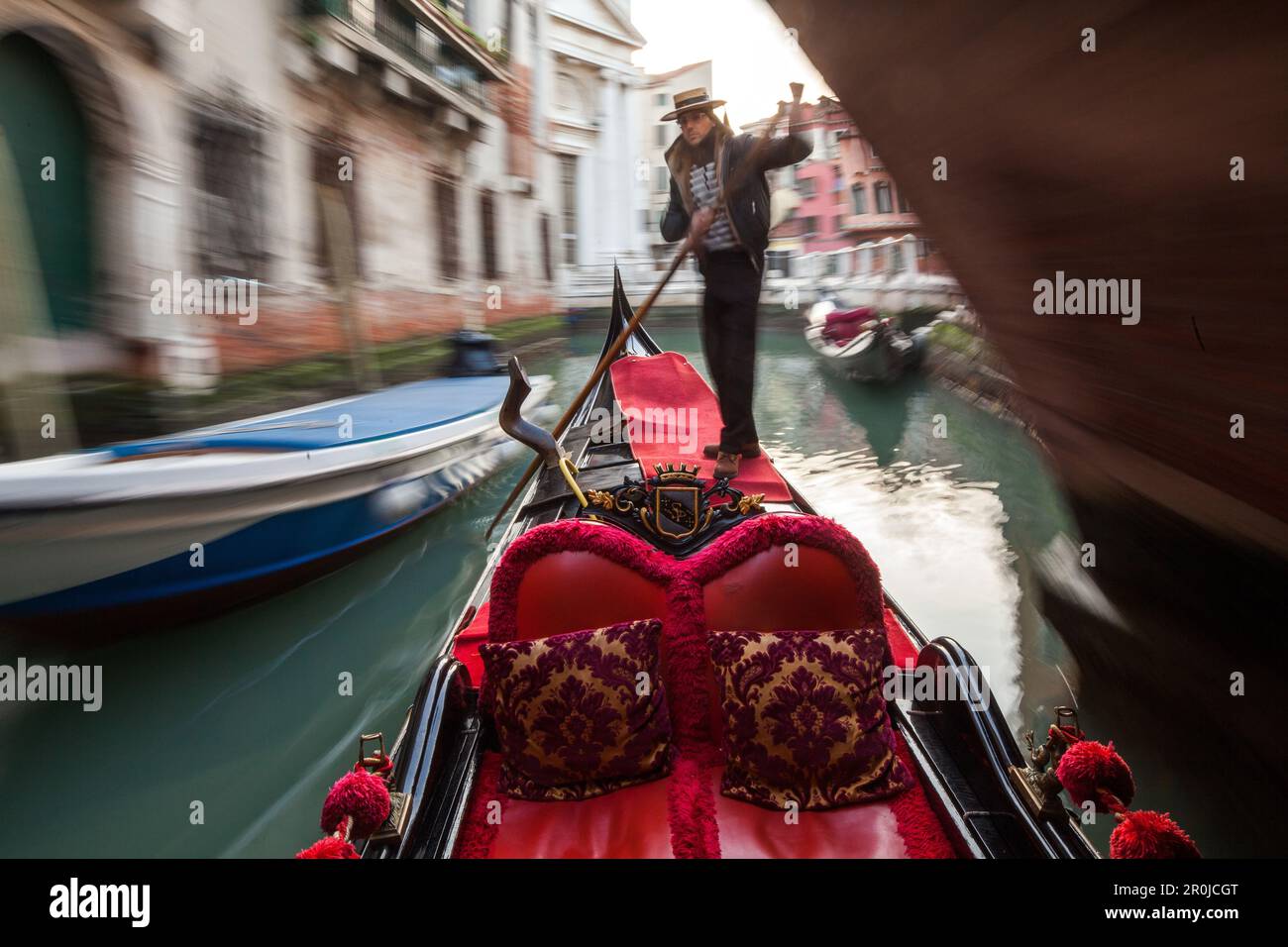 tourist trip on gondola in a narrow canal in historic Castello, art of ...