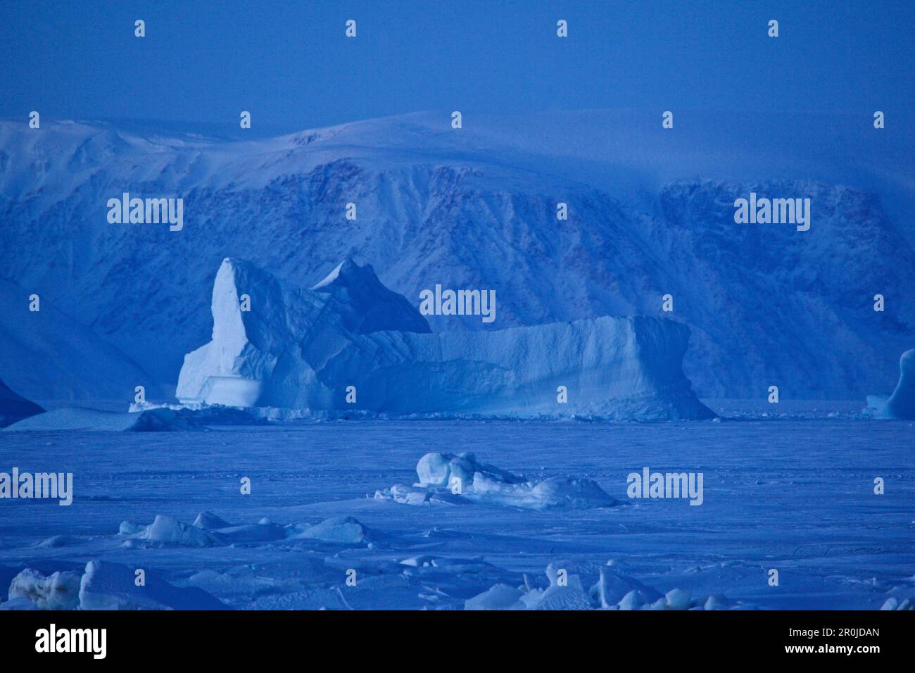 Frozen iceberg in the ocean at Qaanaaq, Northwest Greenland, Greenland ...