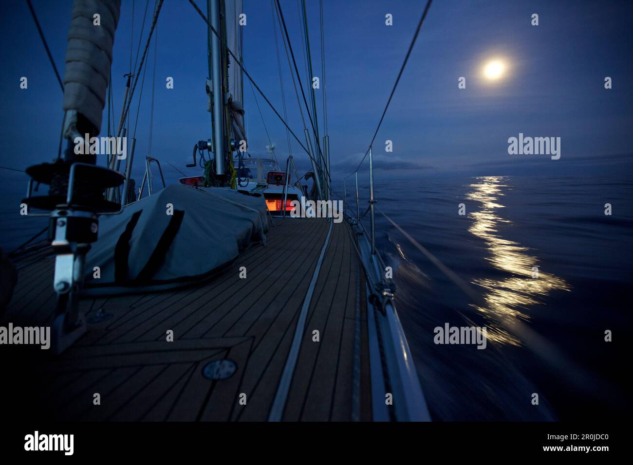 Sailing boat, yacht with night lighting system and full moon during ...