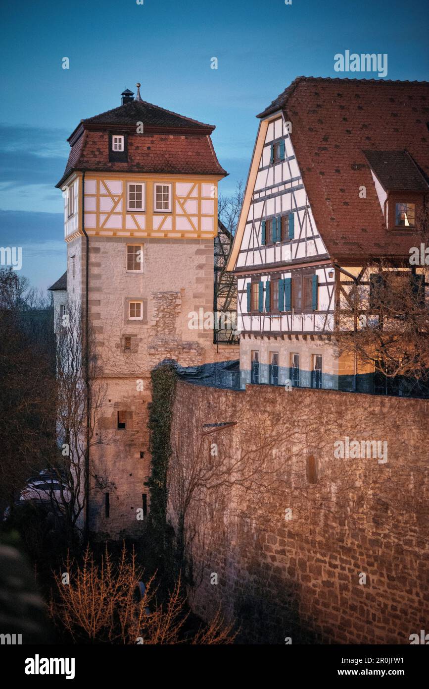 historic town wall and timber-frame house at dusk in Vellberg ...