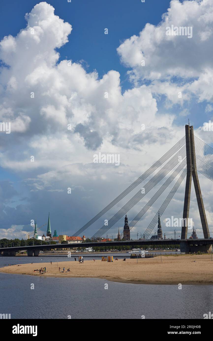 Beach of Kipsala at Vansu Tilts bridge, Daugava river, old town in the ...