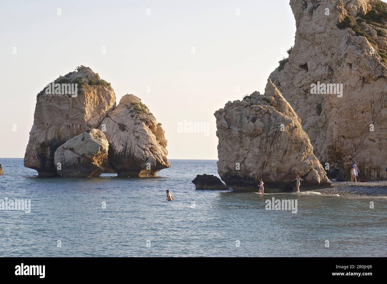 People bathing in teh sea at Petra tou Romiou, Aphrodites rock, Paphos ...