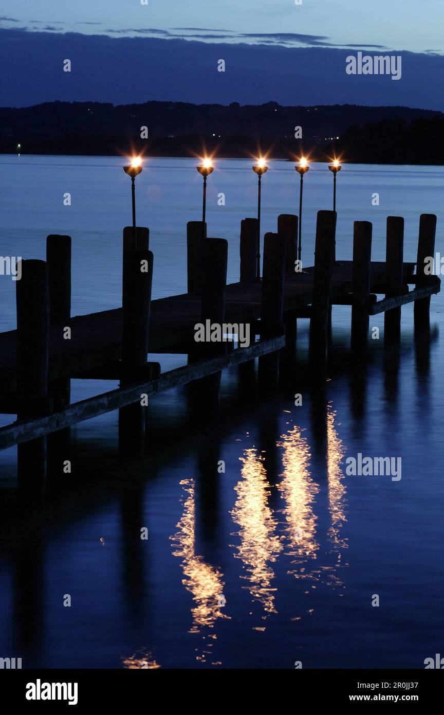 Torches on a pier, Fraueninsel, Chiemsee, Bavaria, Germany Stock Photo ...