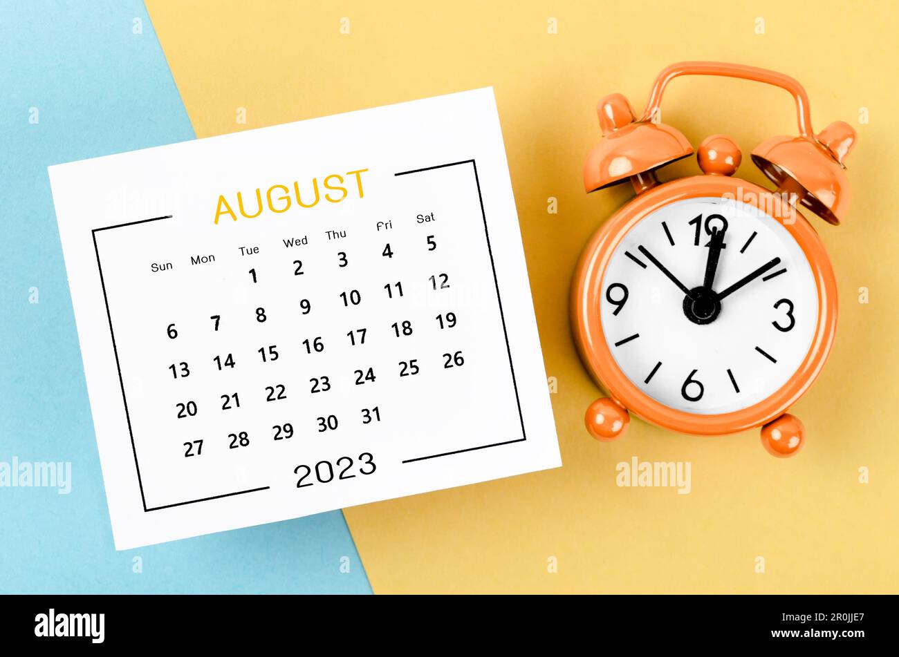 August 2023 Monthly calendar for 2023 year with alarm clock on ...