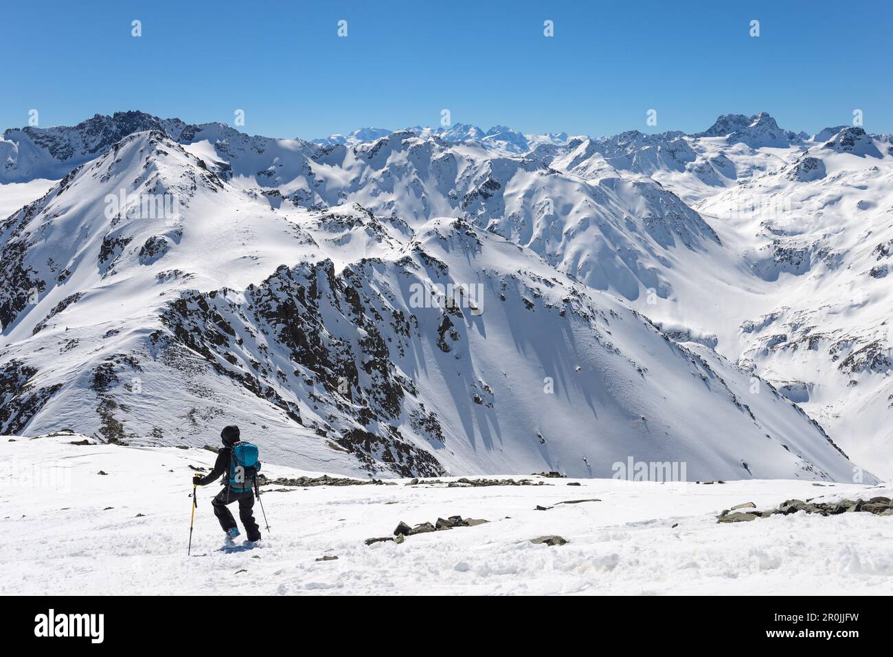 Woman descending from the Schwarzhorn (3147 m), in the middle of the ...