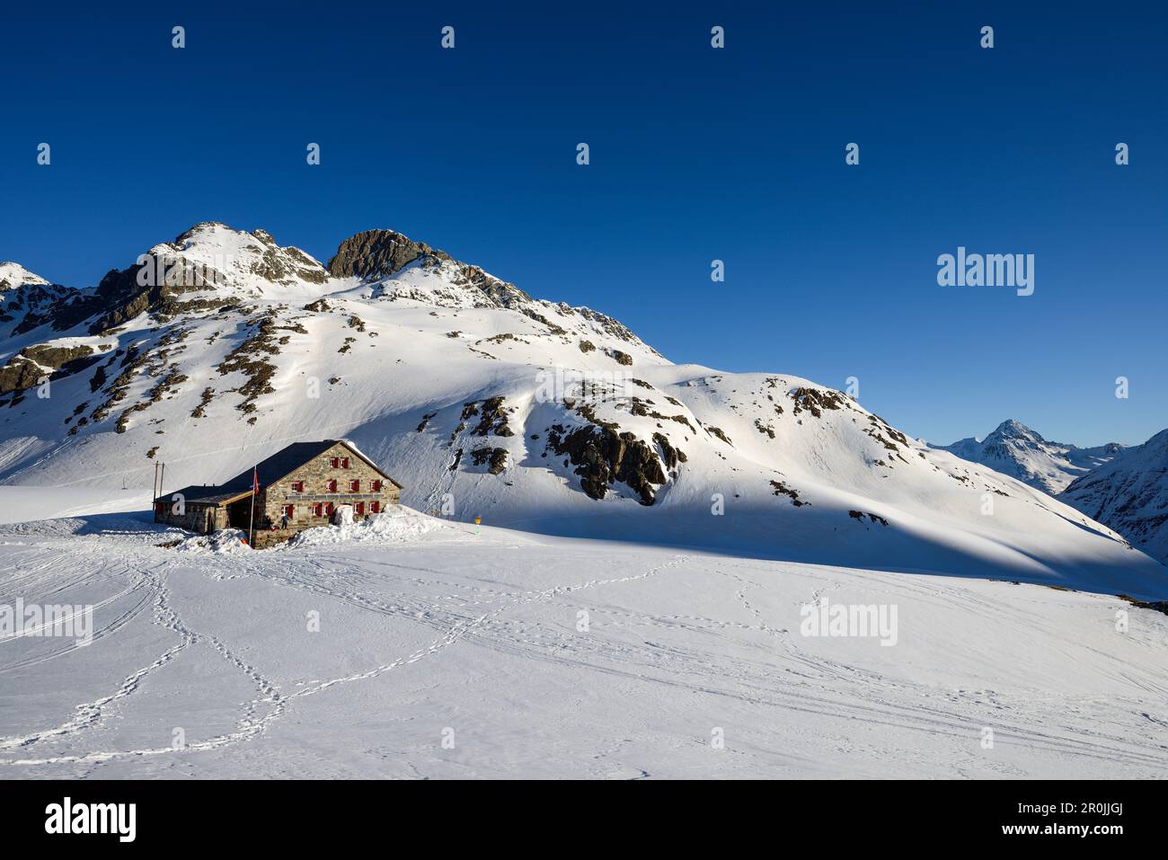 Sunrise at the Grialetsch hut with Piz Radoent (3065 m) above it and ...