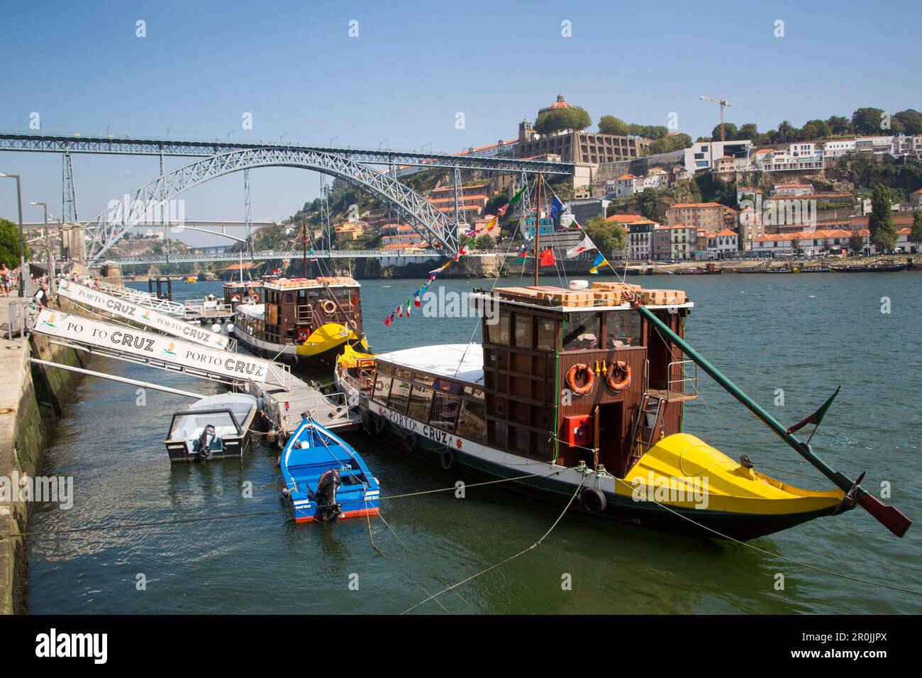 Traditional port wine transport boats and Ponte de Dom Luis bridge over ...
