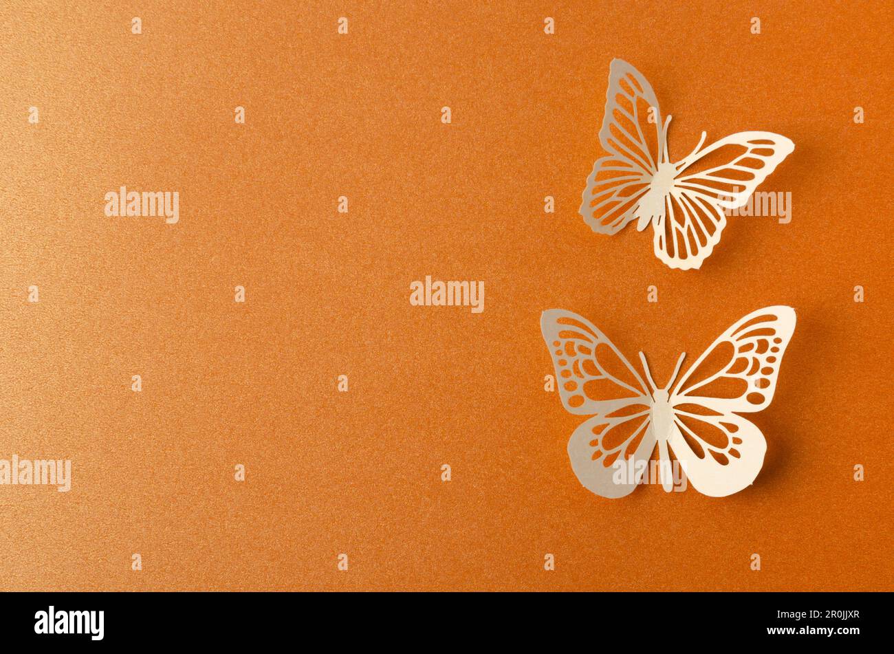 Paper butterflies on a orange paper background with empty space Stock ...